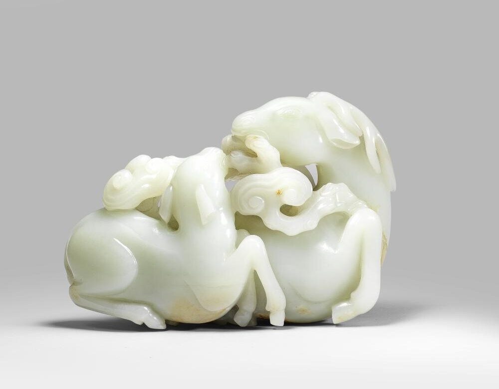 A magnificent large very pale green jade 'stag and young' group ...