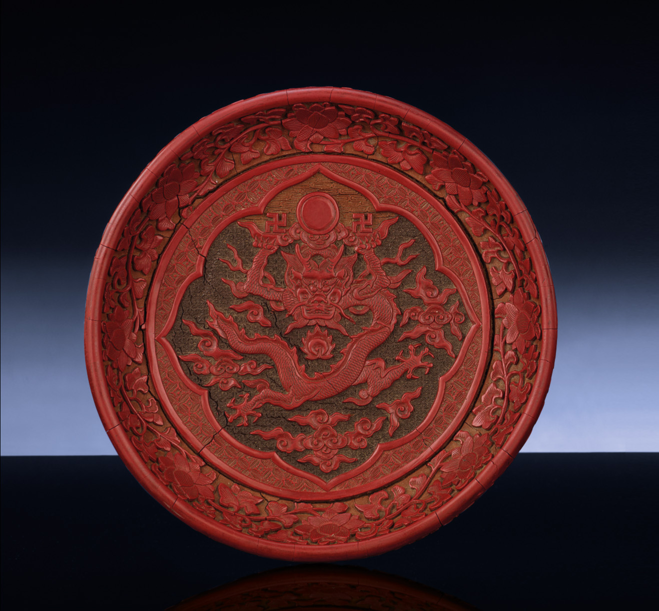 A finely carved late Ming three-colour lacquer dish, Ming dynasty, 16th ...