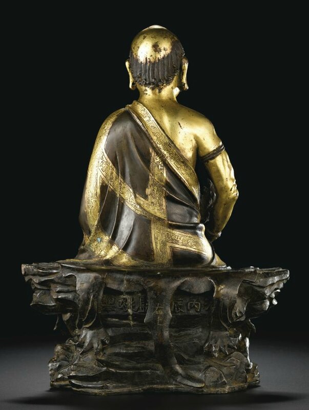 A parcel-gilt bronze figure of a seated luohan, Ming Dynasty, Hongzhi ...