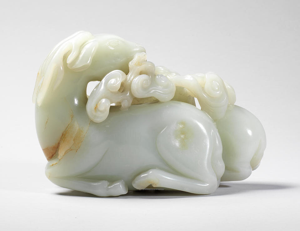A magnificent large very pale green jade 'stag and young' group ...