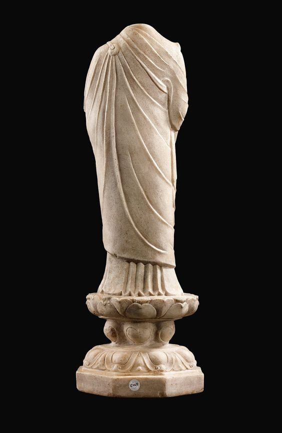 A finely carved white marble standing figure of a monk, probably Ananda ...
