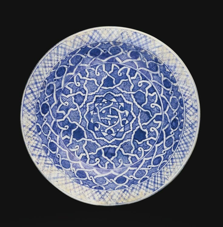A Timurid blue and white pottery dish with geometric design, Persia ...