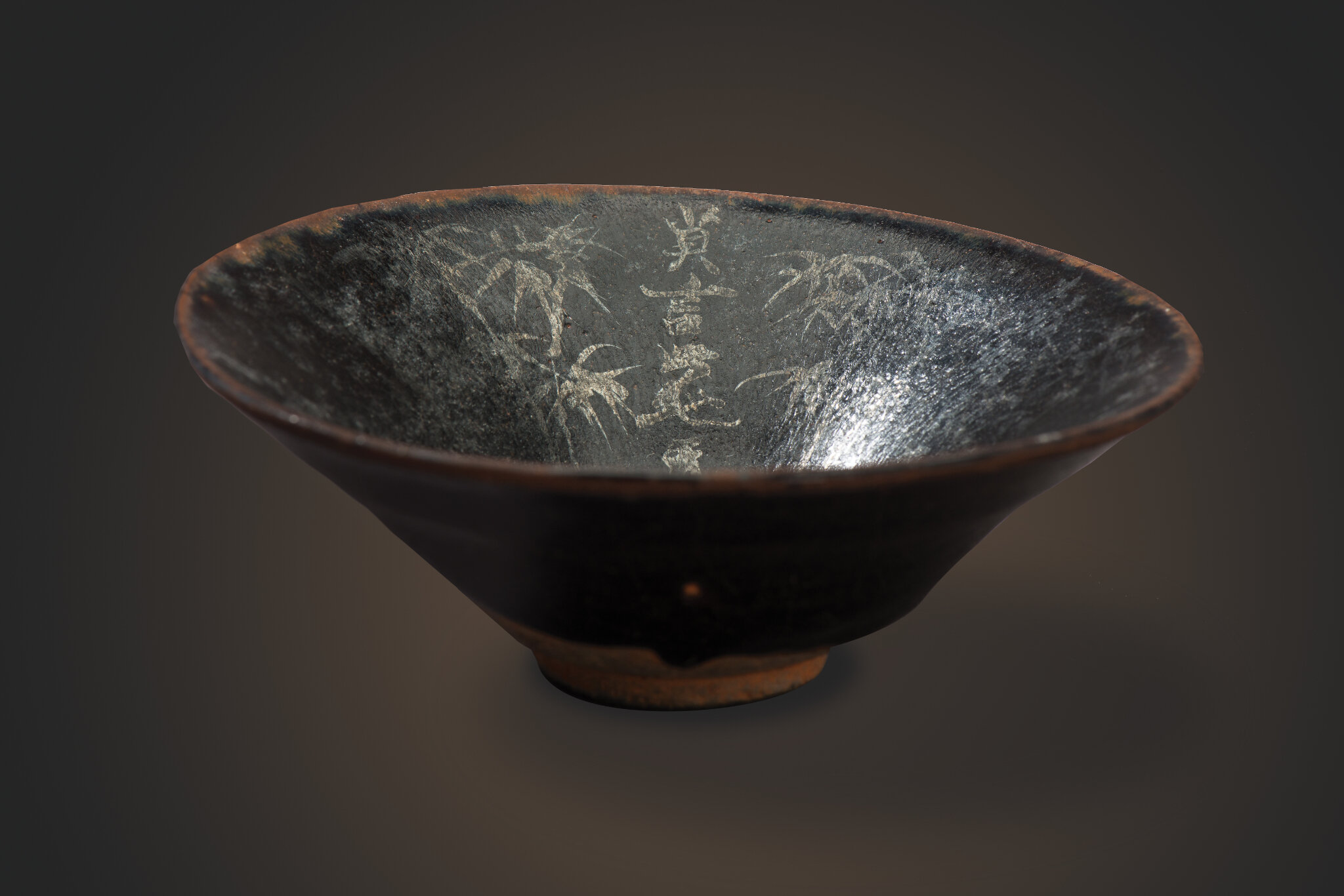 An important and unique Chinese Jizhou-type black-glazed and gold lustre 'inscribed' bowl, Late ...