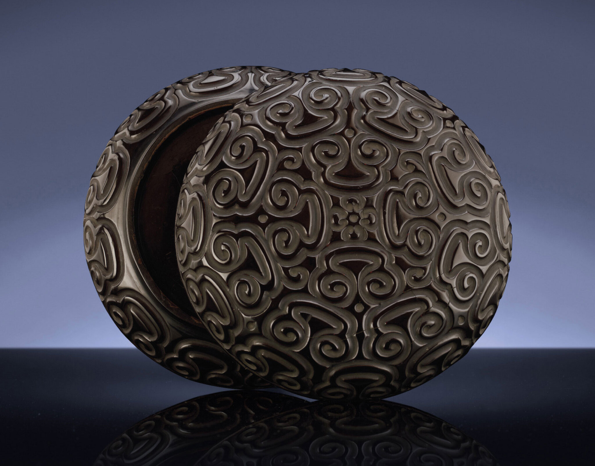 A rare Ming carved black tixi lacquer circular box and cover, Ming ...