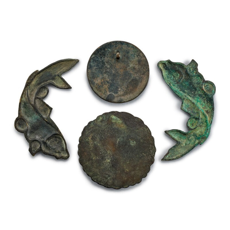 Two bronze mirrors and a pair of bronze 'fish' plaques, Yuan dynasty ...
